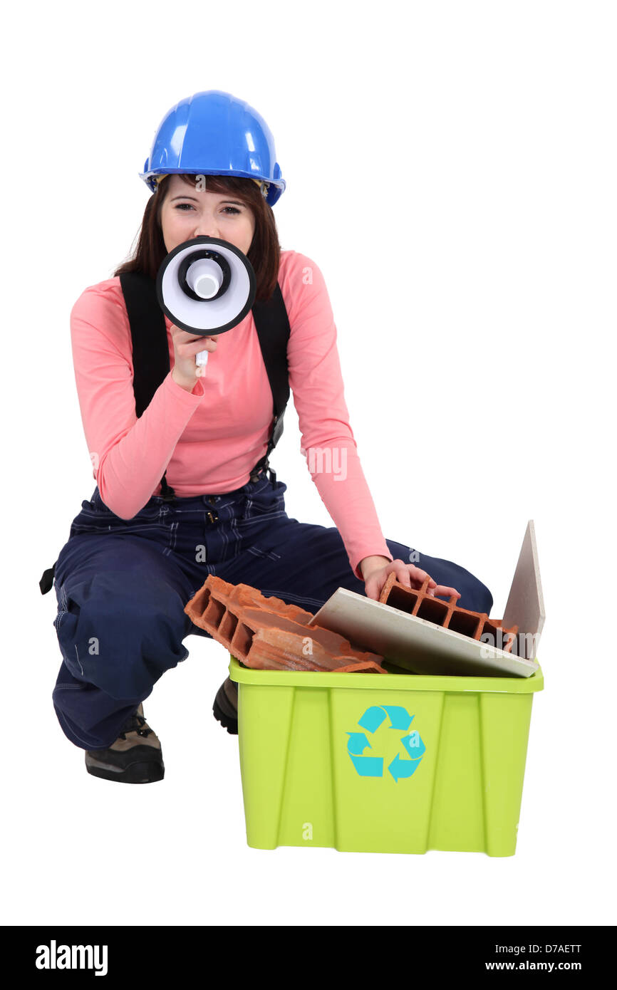 A female construction worker promoting recycling Stock Photo - Alamy