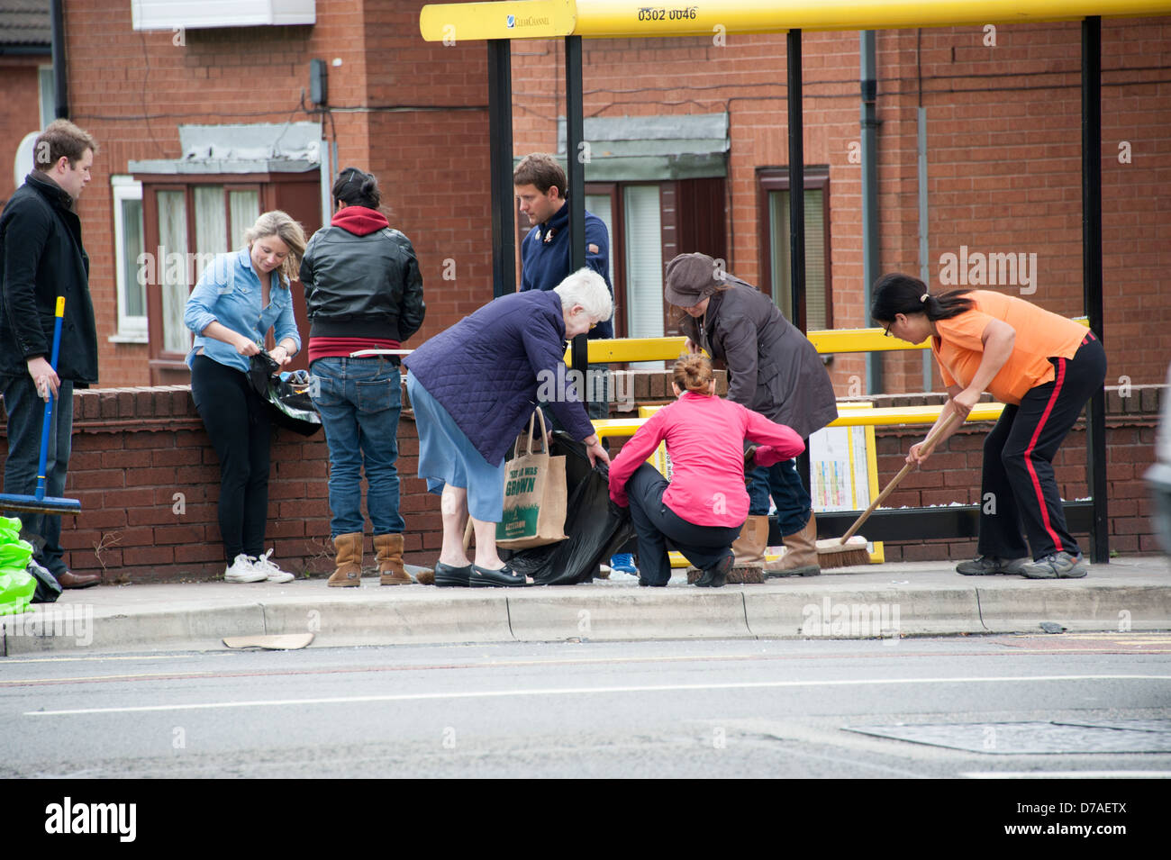 Residents cleaning streets after riot Liverpool Stock Photo - Alamy