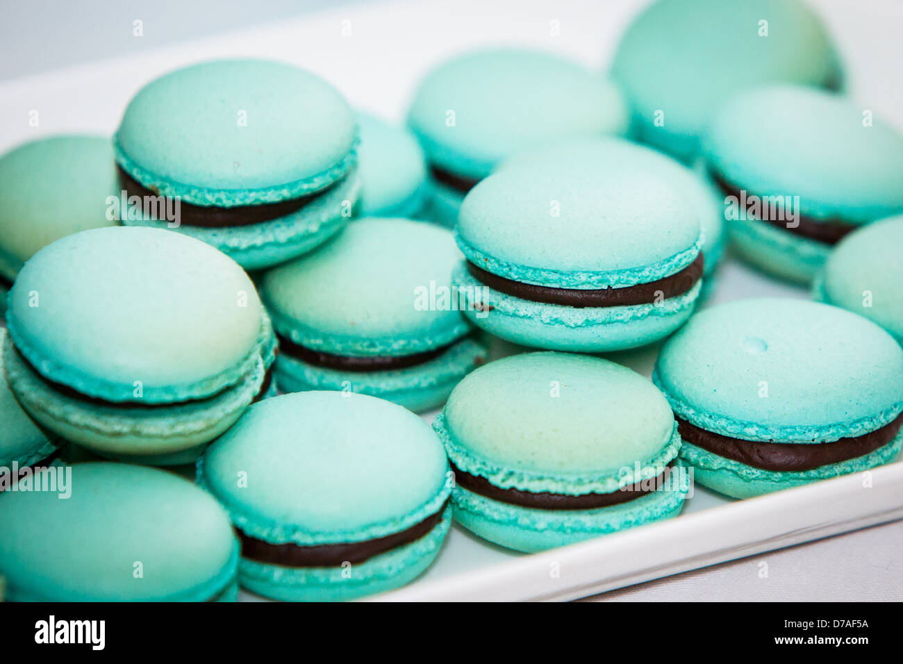A plate full of macarons ready to be eaten Stock Photo - Alamy