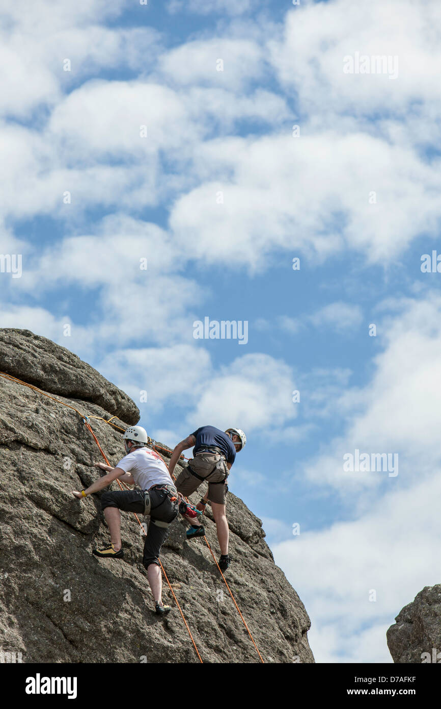 Climbers on Haytor, also known as Haytor Rocks, Dartmoor National Park ...