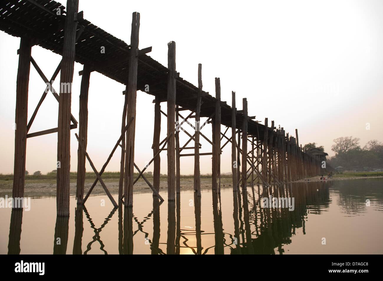 The U Bein Bridge spans across the Taungthaman Lake in Amarapura ...
