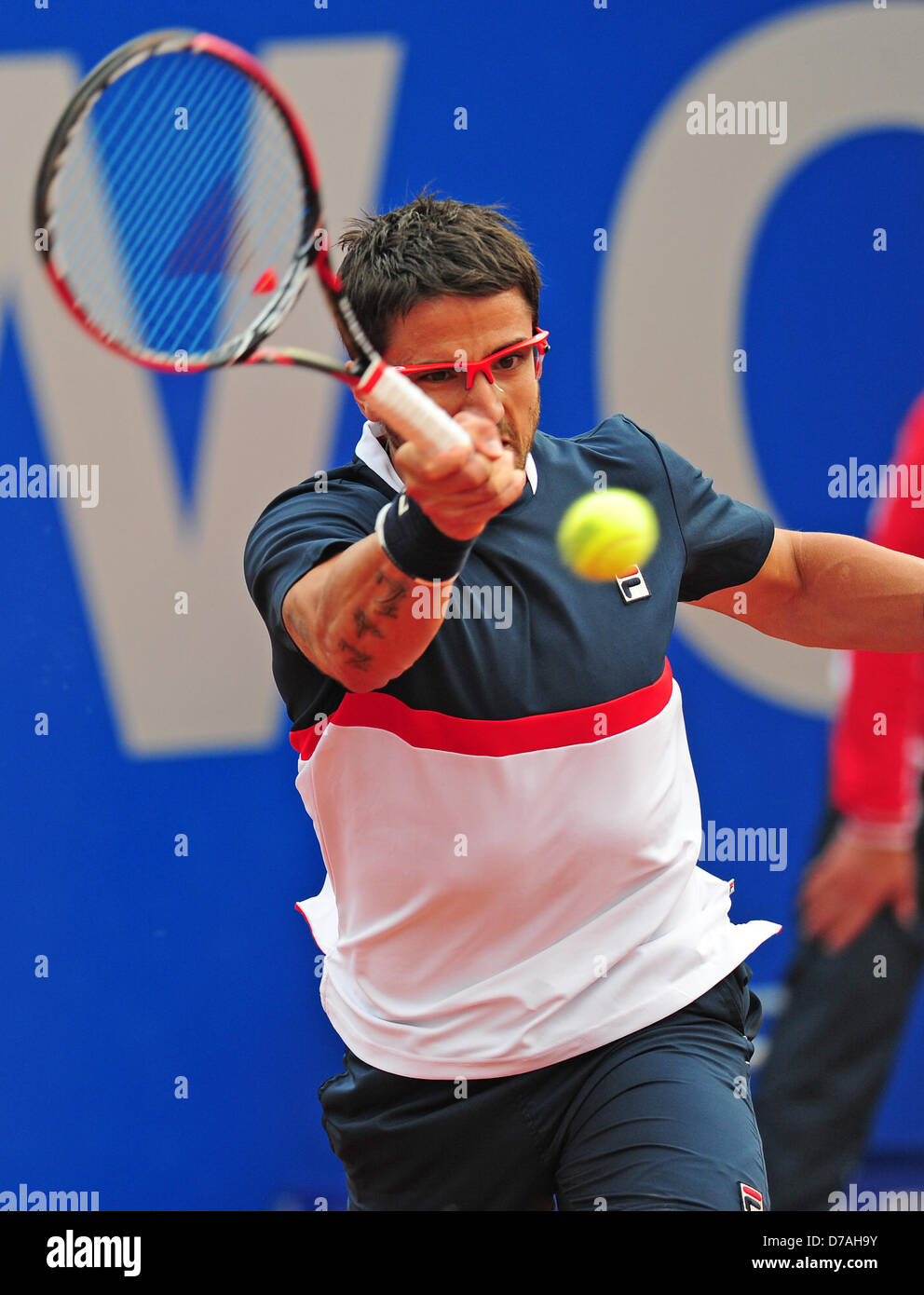 Serbia's Janko Tipsarevic returns the ball during the round of sixteen ...