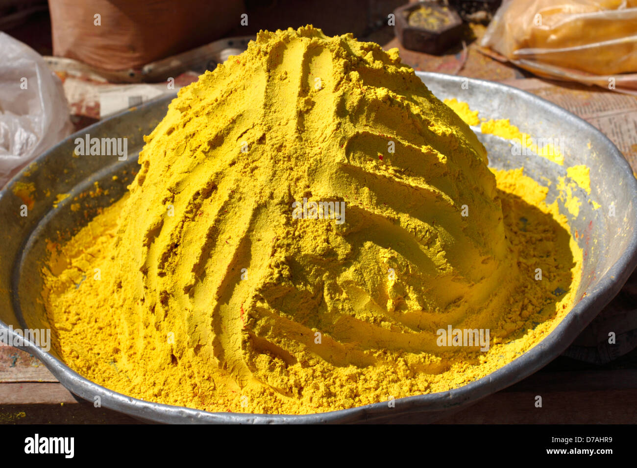 Brightly powdered yellow dye at a market in Karnataka, India Stock ...