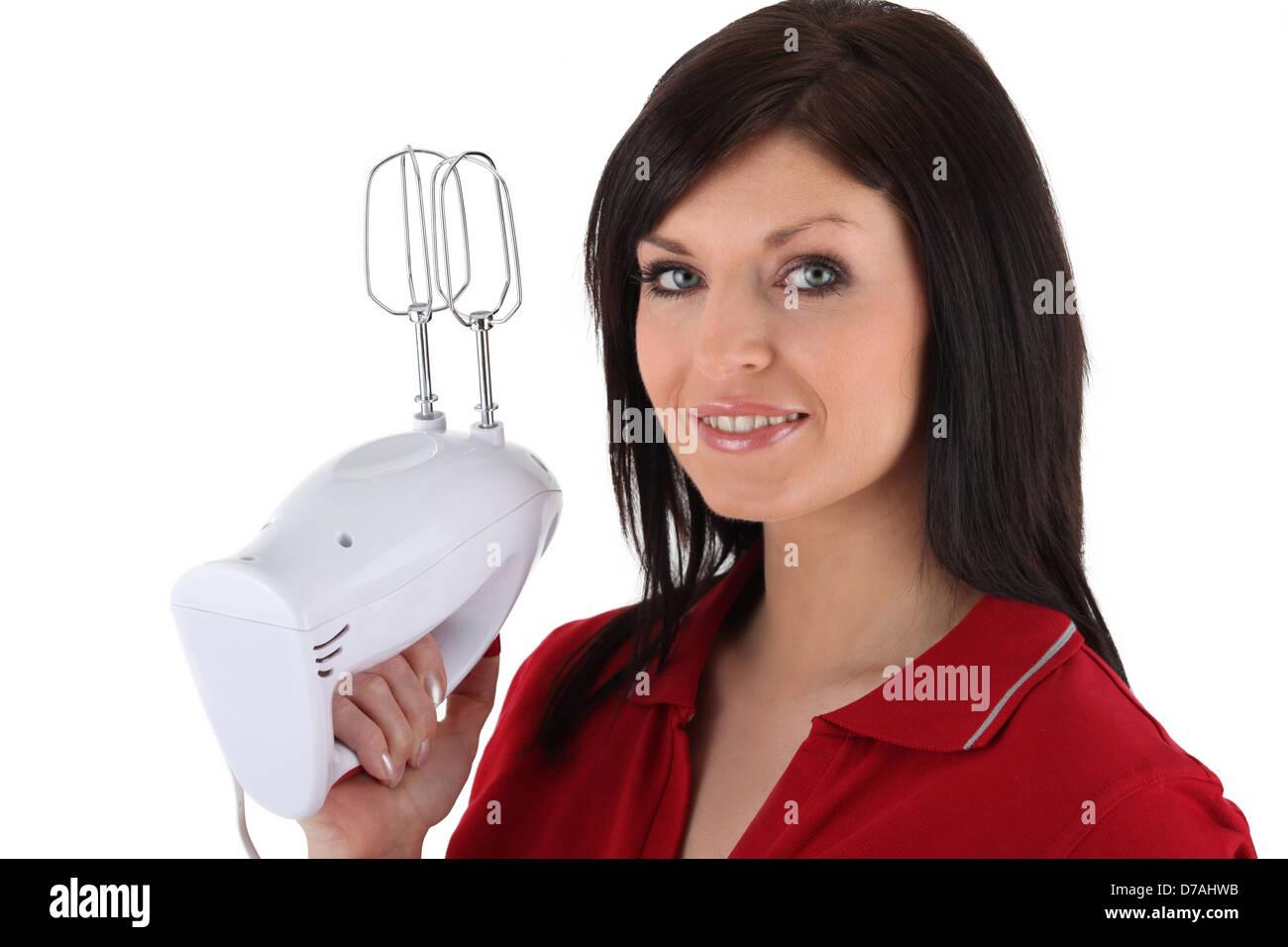 Woman holding up a mixer Stock Photo - Alamy