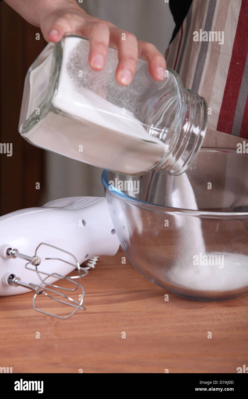 Man pouring sugar into bowl Stock Photo - Alamy Man pouring sugar into bowl Stock Photo - Alamy
