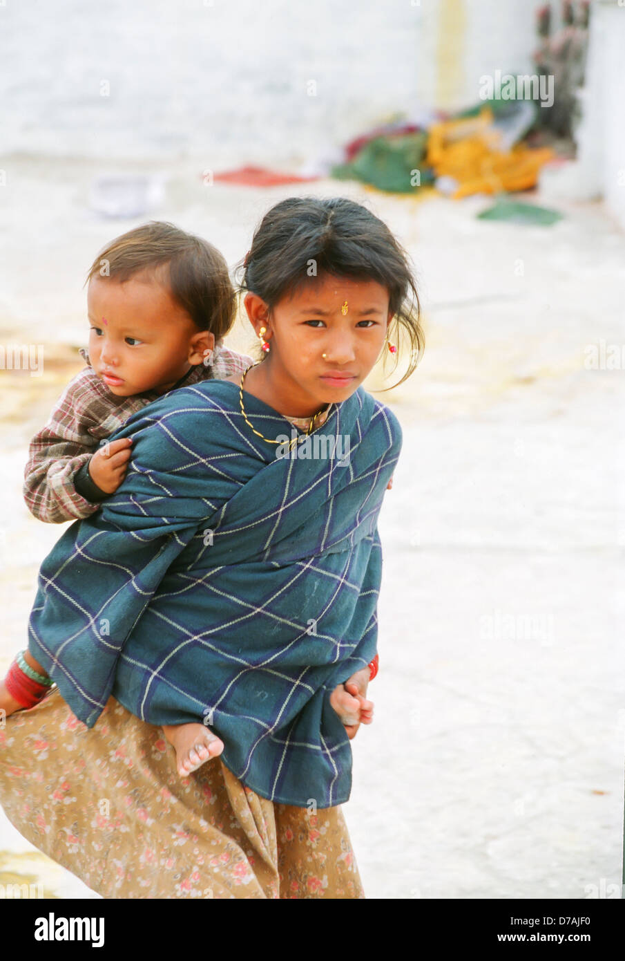 Urban poverty and third world lifestyle in Nepal: Young girl beggar ...
