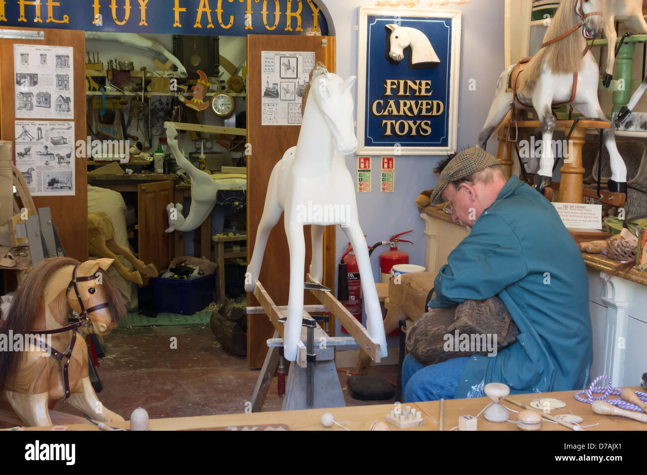 A wood carver at work in the Toy Factory in Preston Park Museum ...