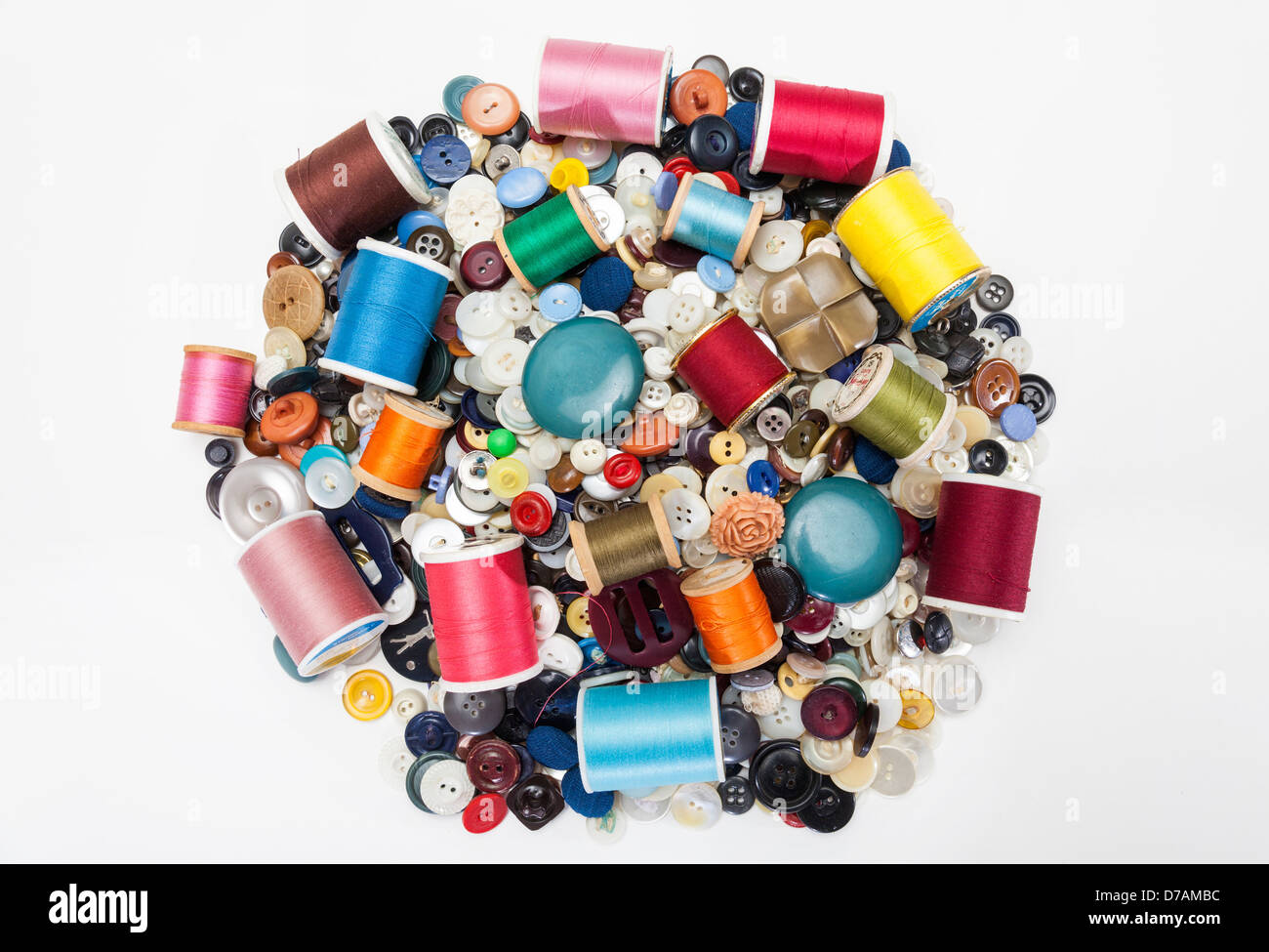 A collection of buttons and spools of sewing thread Stock Photo - Alamy