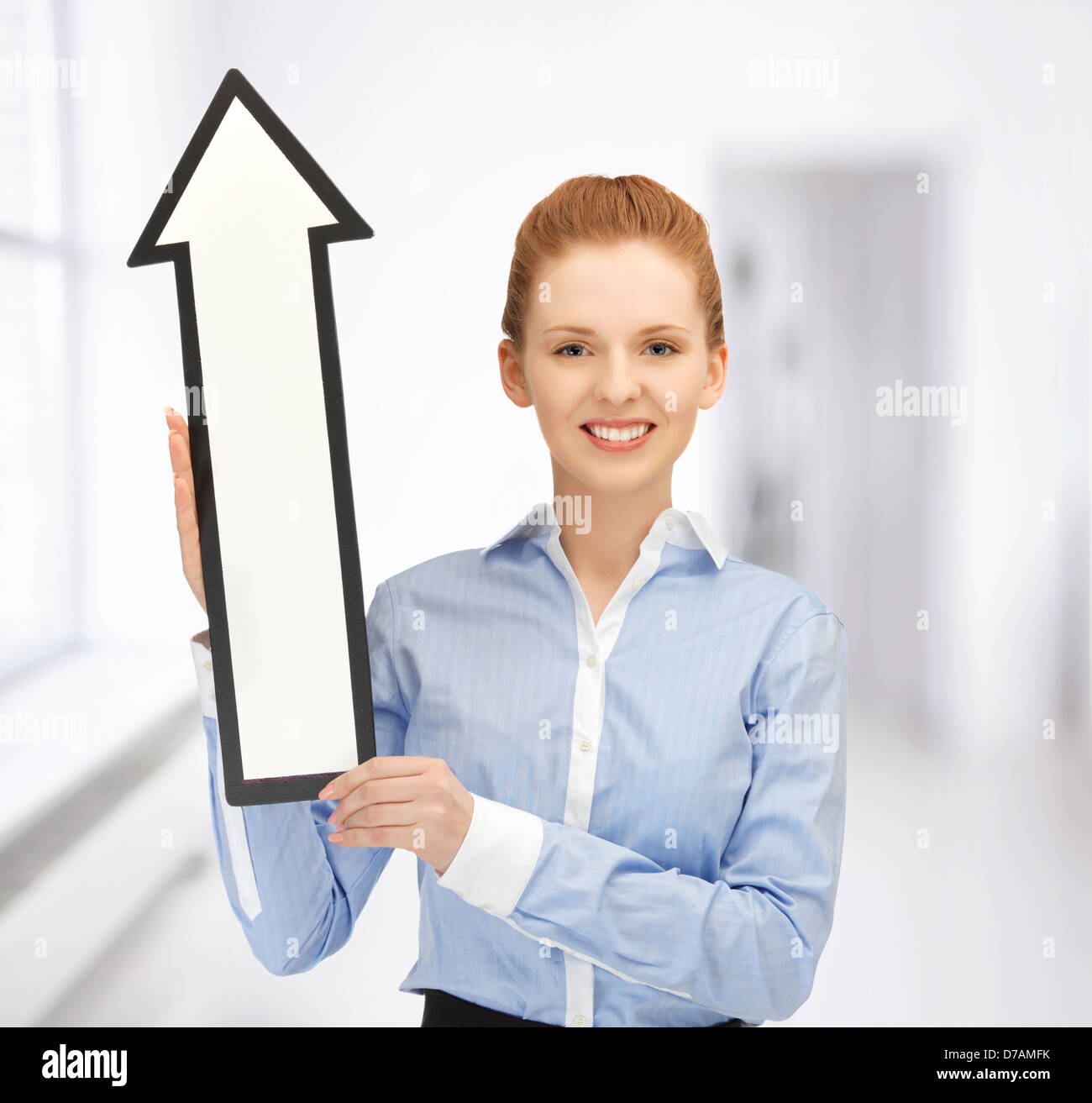 woman with direction arrow sign Stock Photo - Alamy