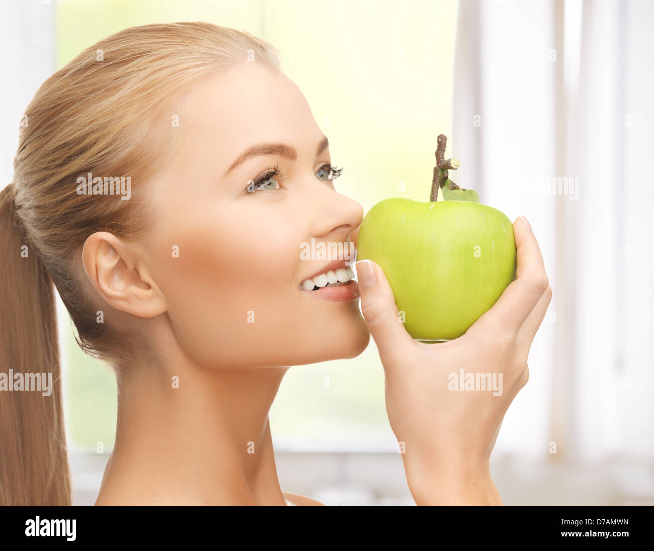 woman smelling apple Stock Photo - Alamy