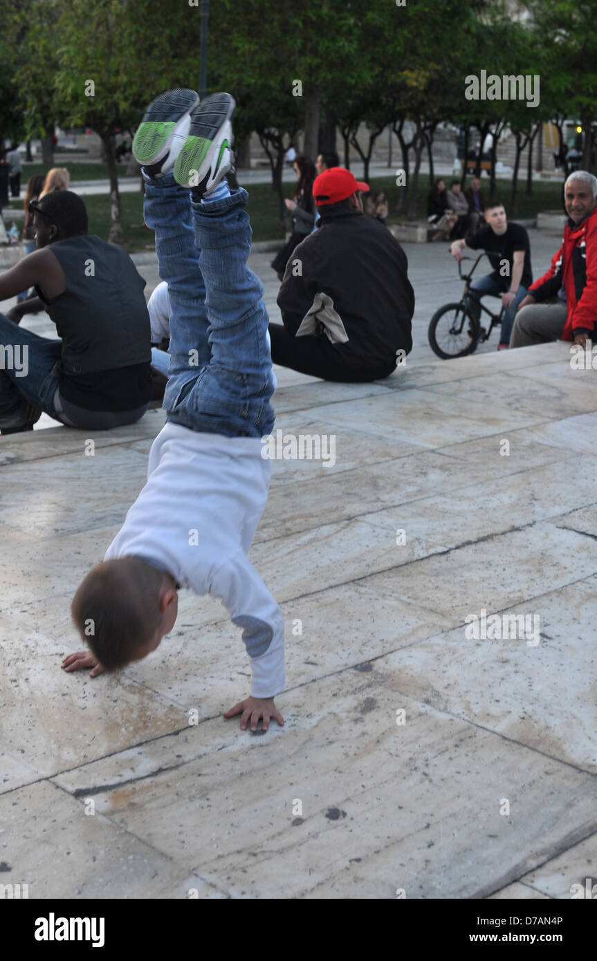 A young boy in balance on his hands Stock Photo - Alamy