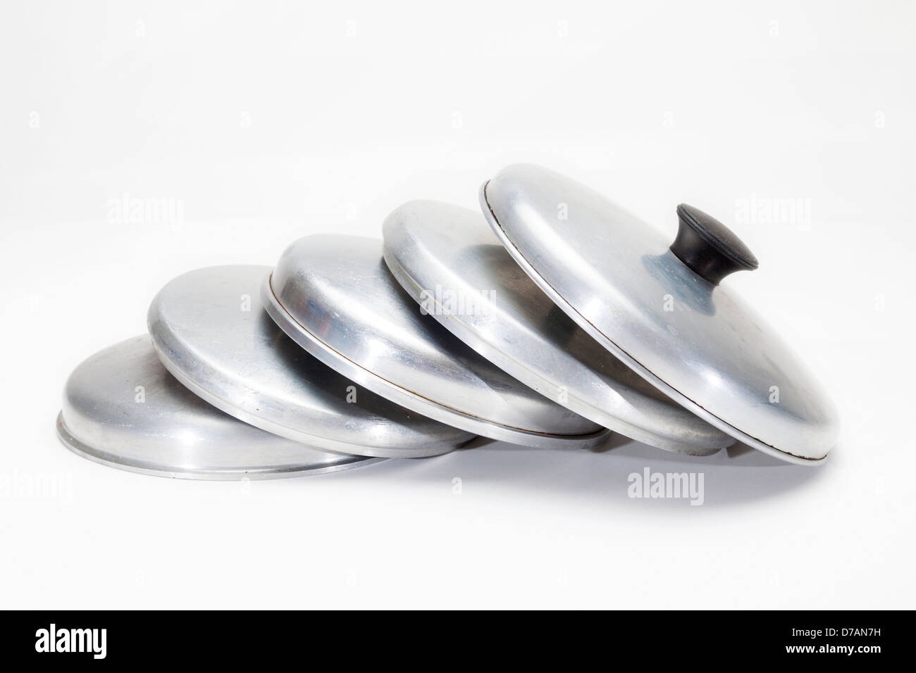 A collection of pot lids for cookware and frying pans Stock Photo - Alamy