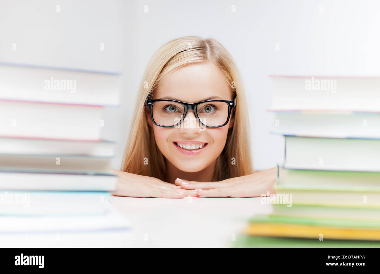student with stack of books Stock Photo - Alamy