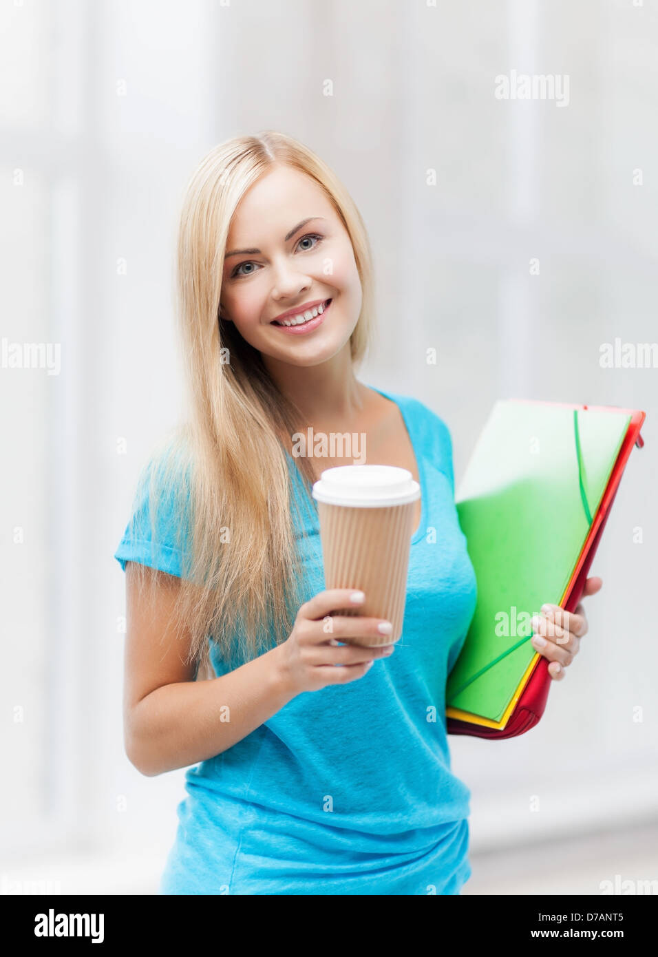 smiling student with folders Stock Photo - Alamy