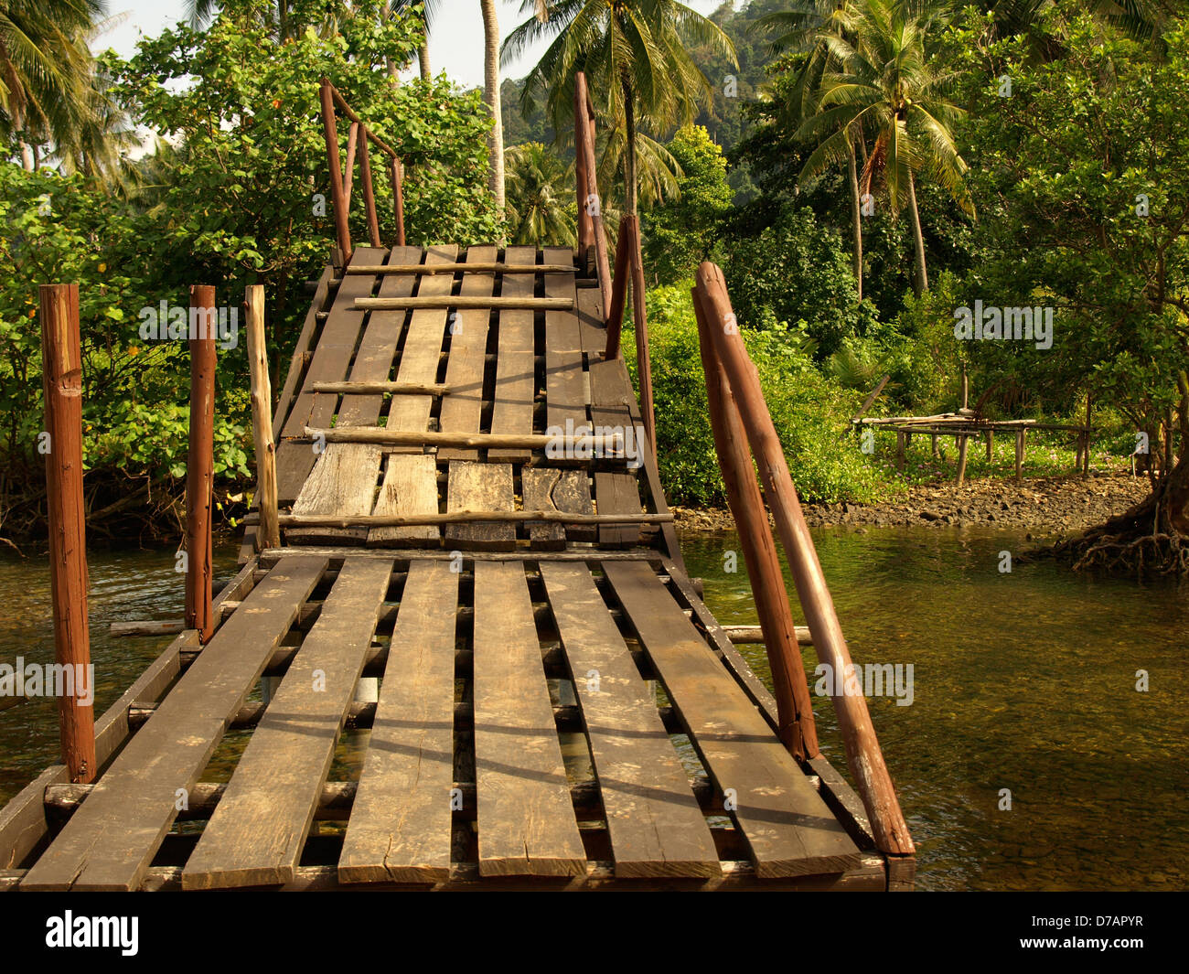 a bridge over a clear jungle stream in Thailand Stock Photo - Alamy