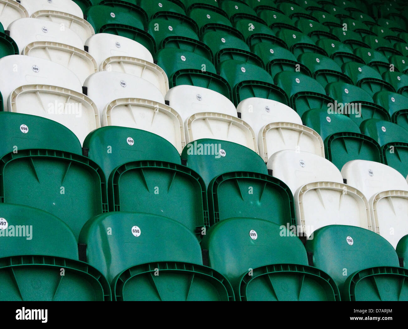 A group of white and green seating at a Rugby Stadium Stock Photo - Alamy