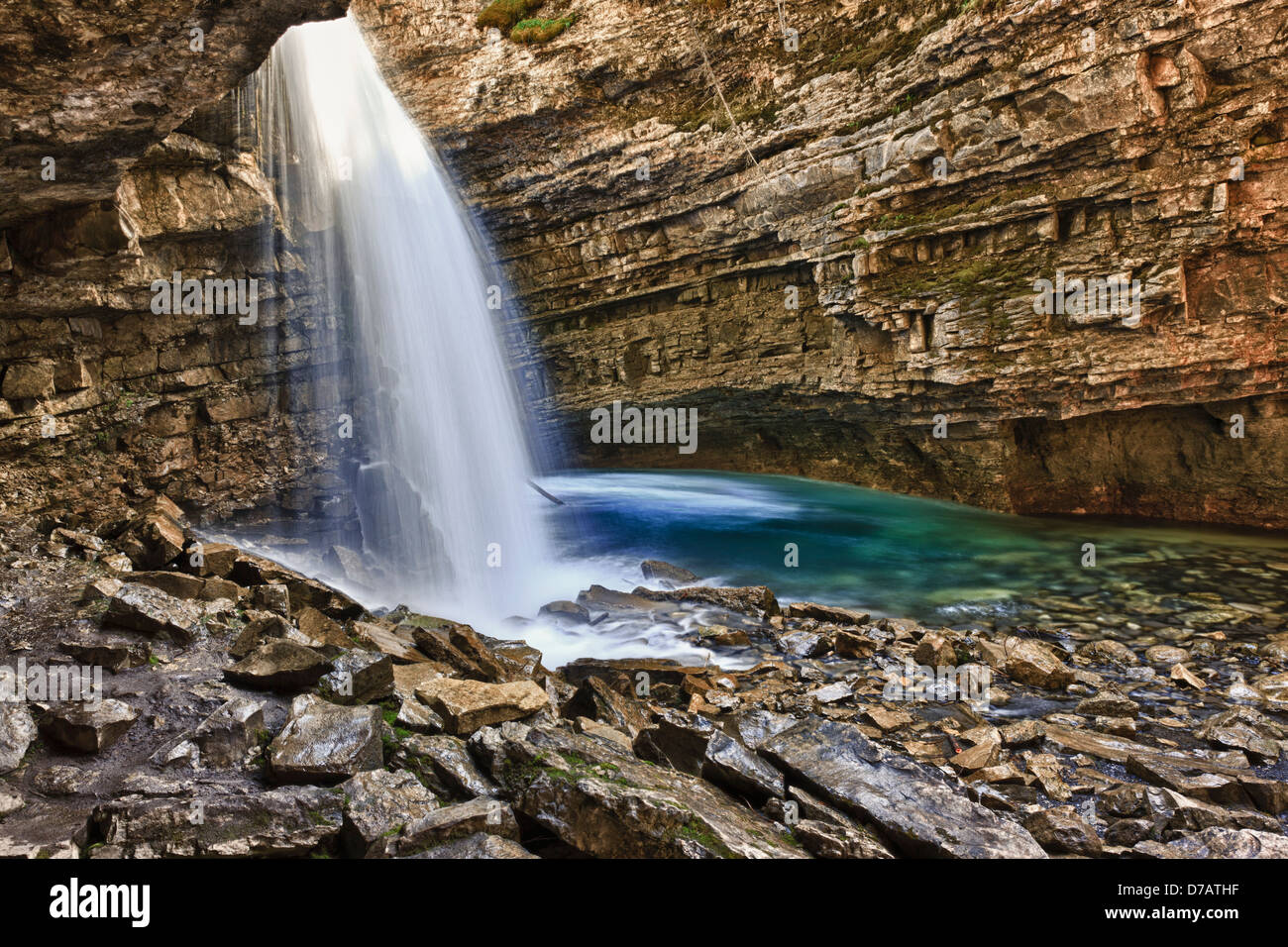A River Cascades Over A Small Waterfall In Johnston Canyon In Banff ...
