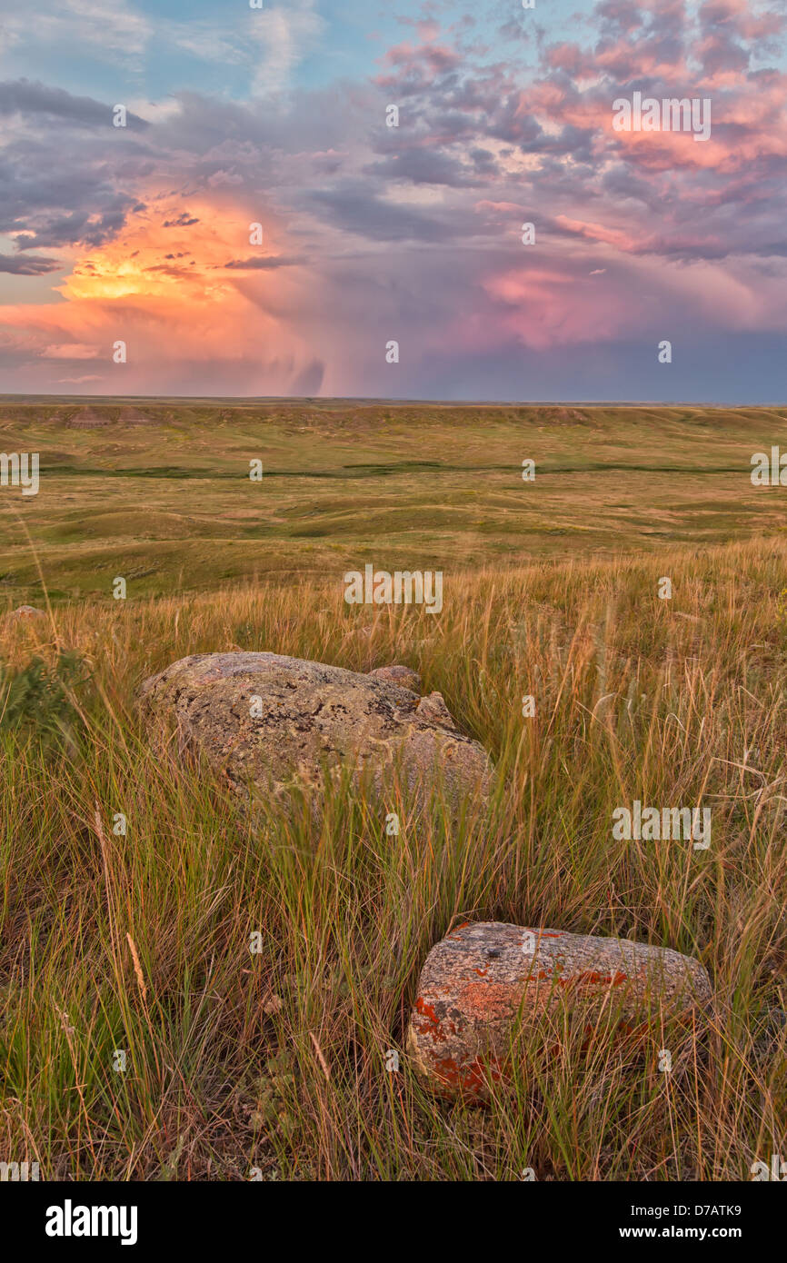 A Large Storm Cell Is Seen On The Horizon At Sunset In Grasslands ...
