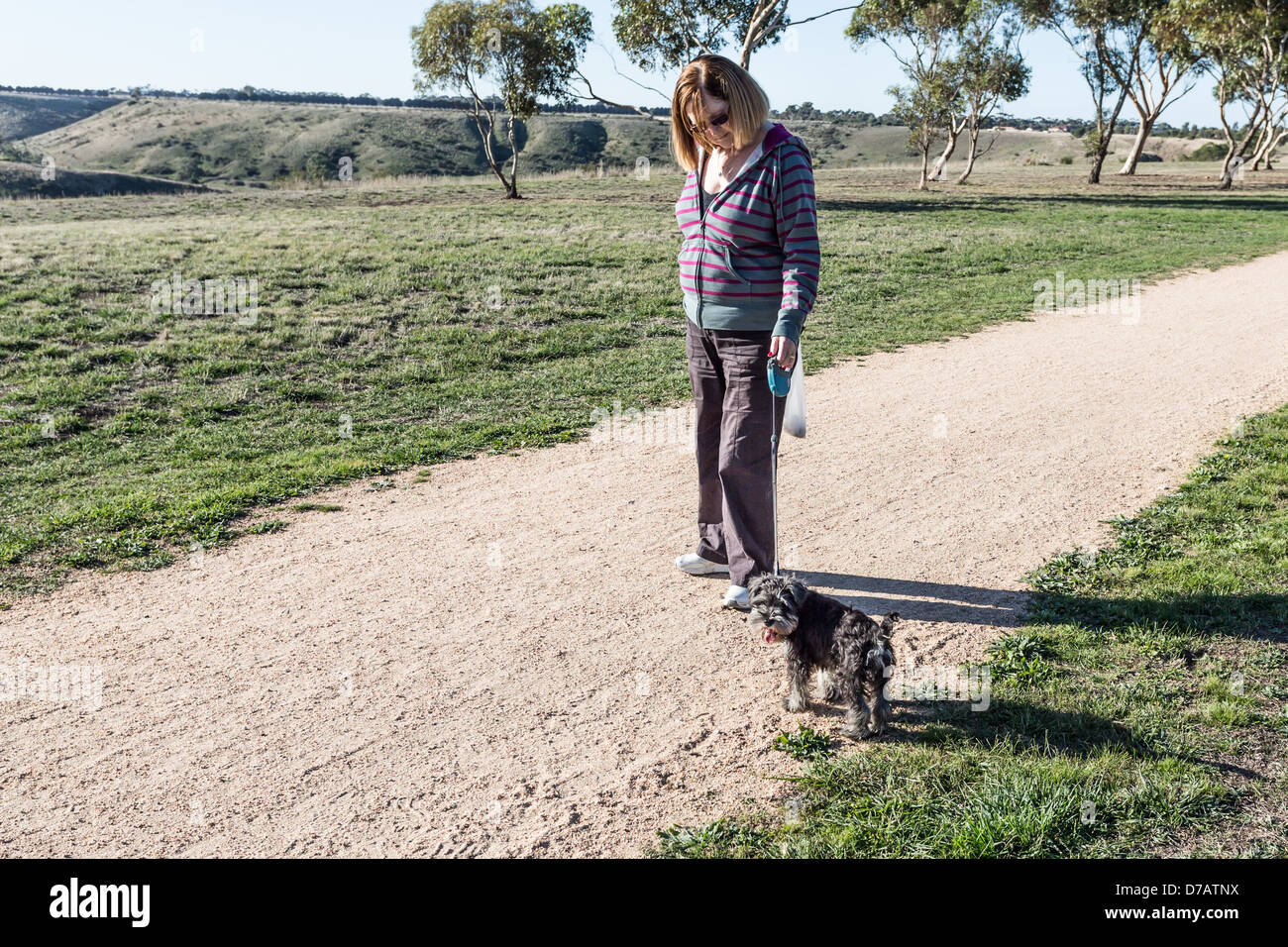 Woman walking on street new hi-res stock photography and images - Alamy