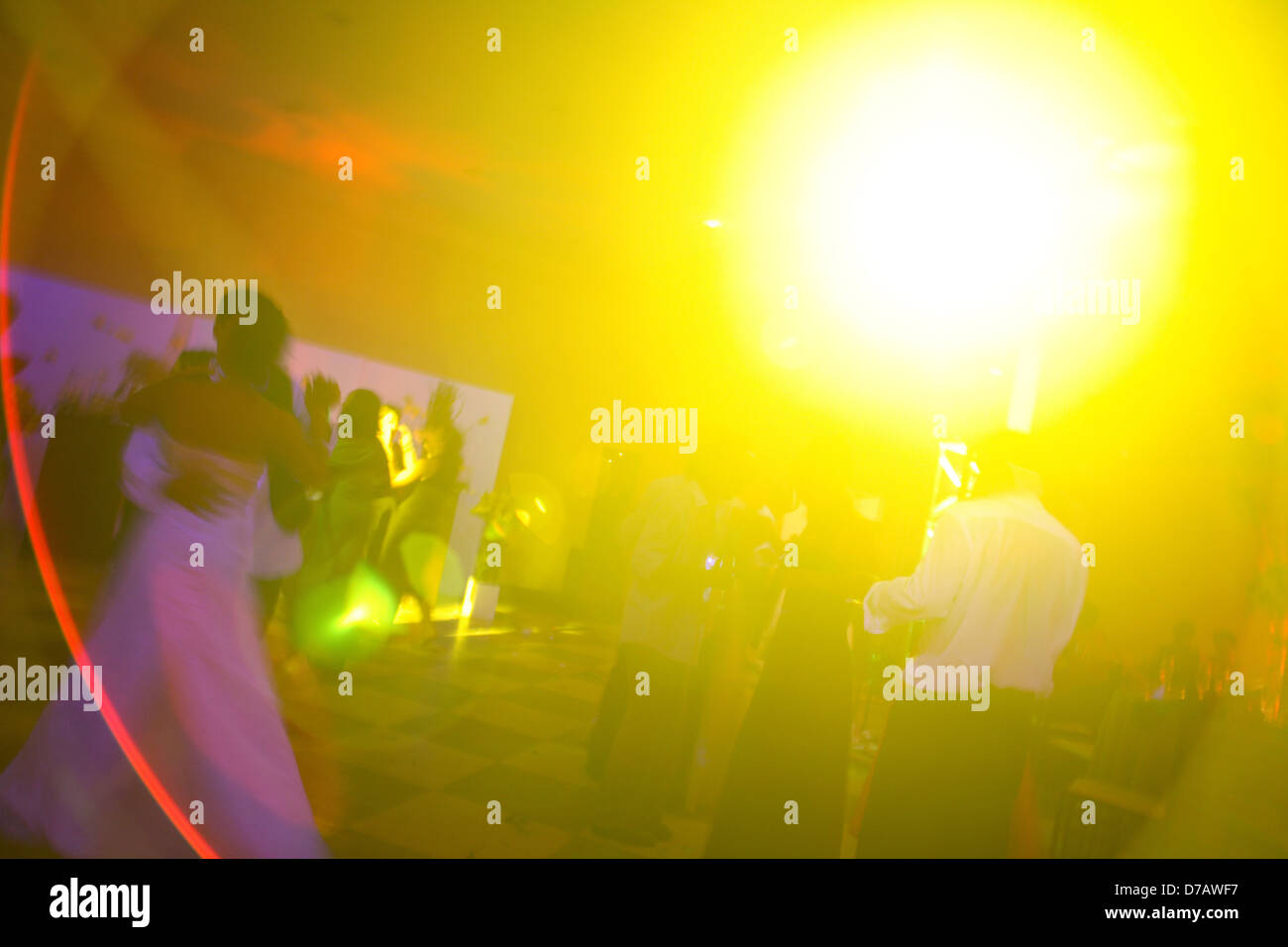 Bride and Groom dancing on the Wedding dance floor with Big light ...