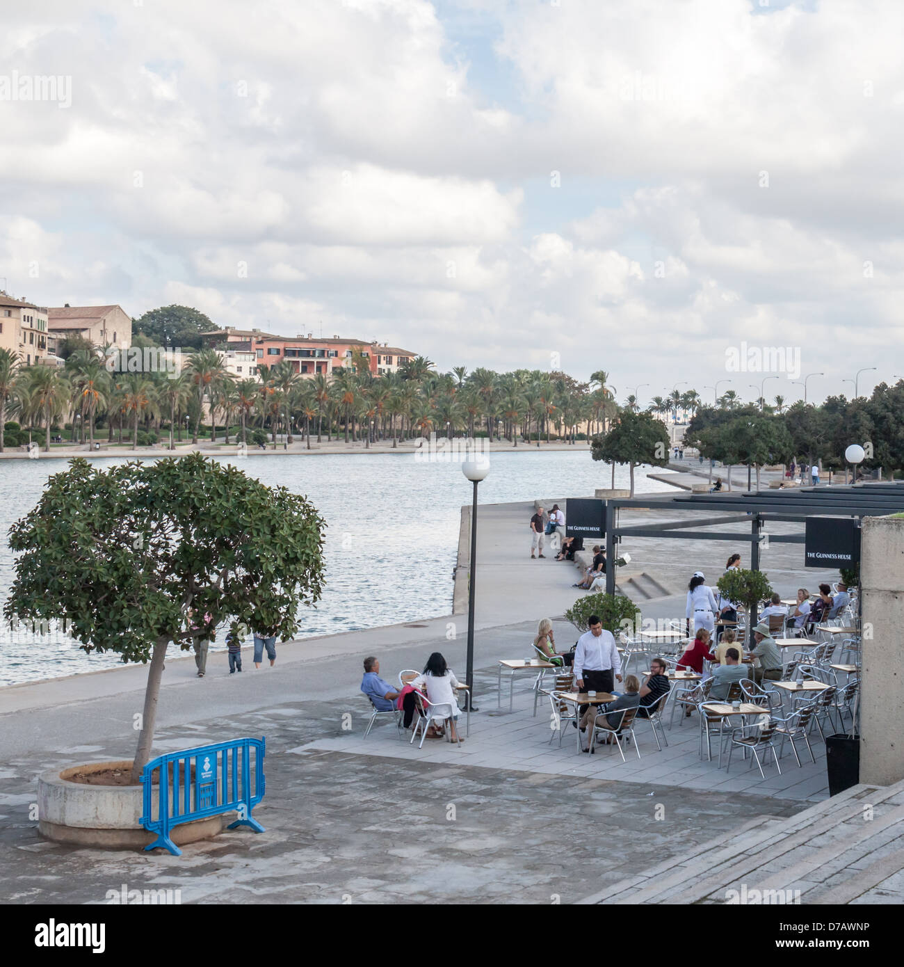 People enjoying cafe on boardwalk at Palma Majorca Catedral de Mallorca ...