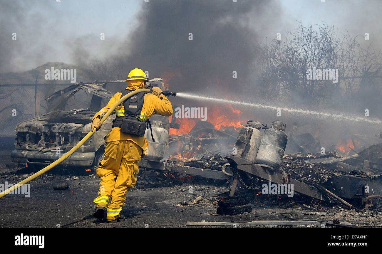 Camarillo, CA, USA. May 2, 2013. Firefighters try to put out motorhomes ...