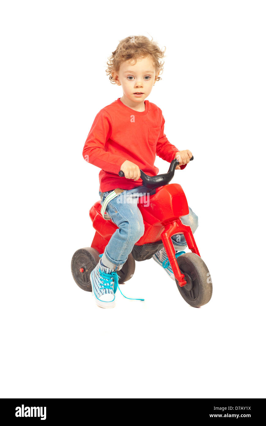 Cute toddler boy riding a bike isolated on white background Stock Photo ...