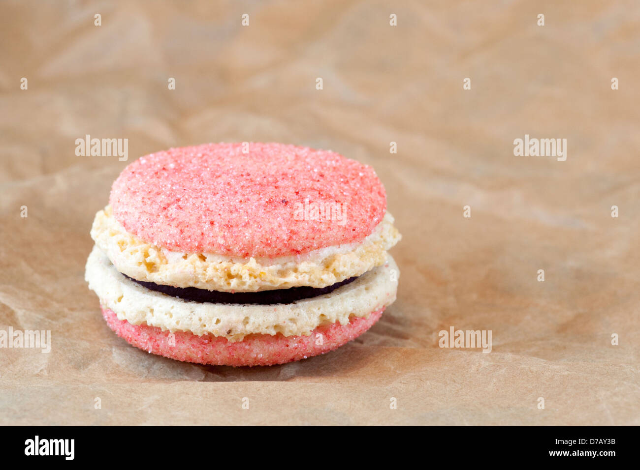 Blackcurrant and violet macaron on brown paper Stock Photo - Alamy