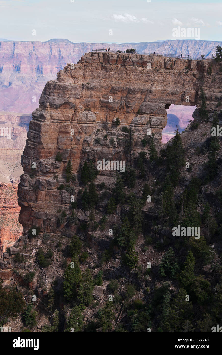 Visitors explore top of angel's window on north rim of grand canyon ...