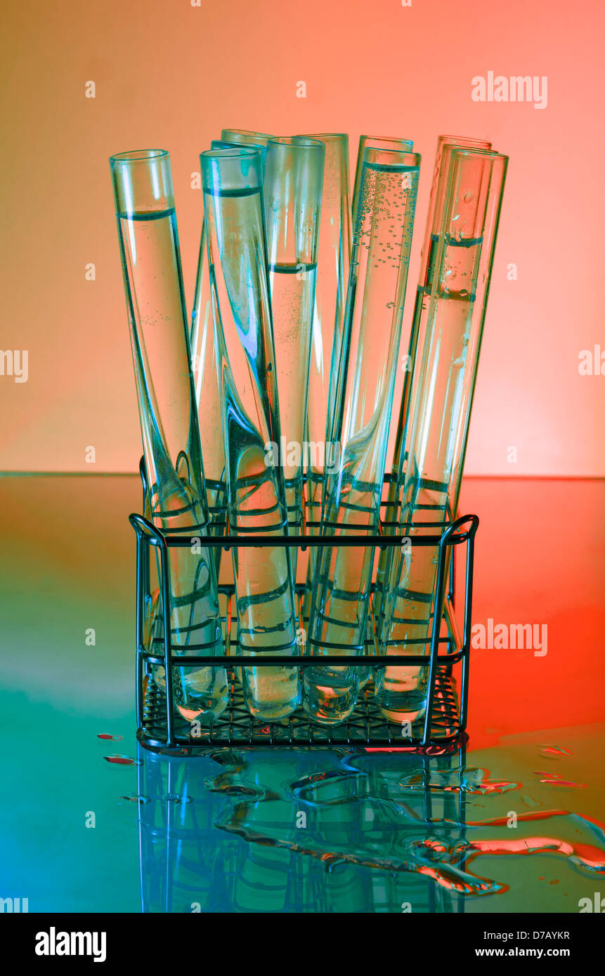 rack of test tubes on red background Stock Photo - Alamy