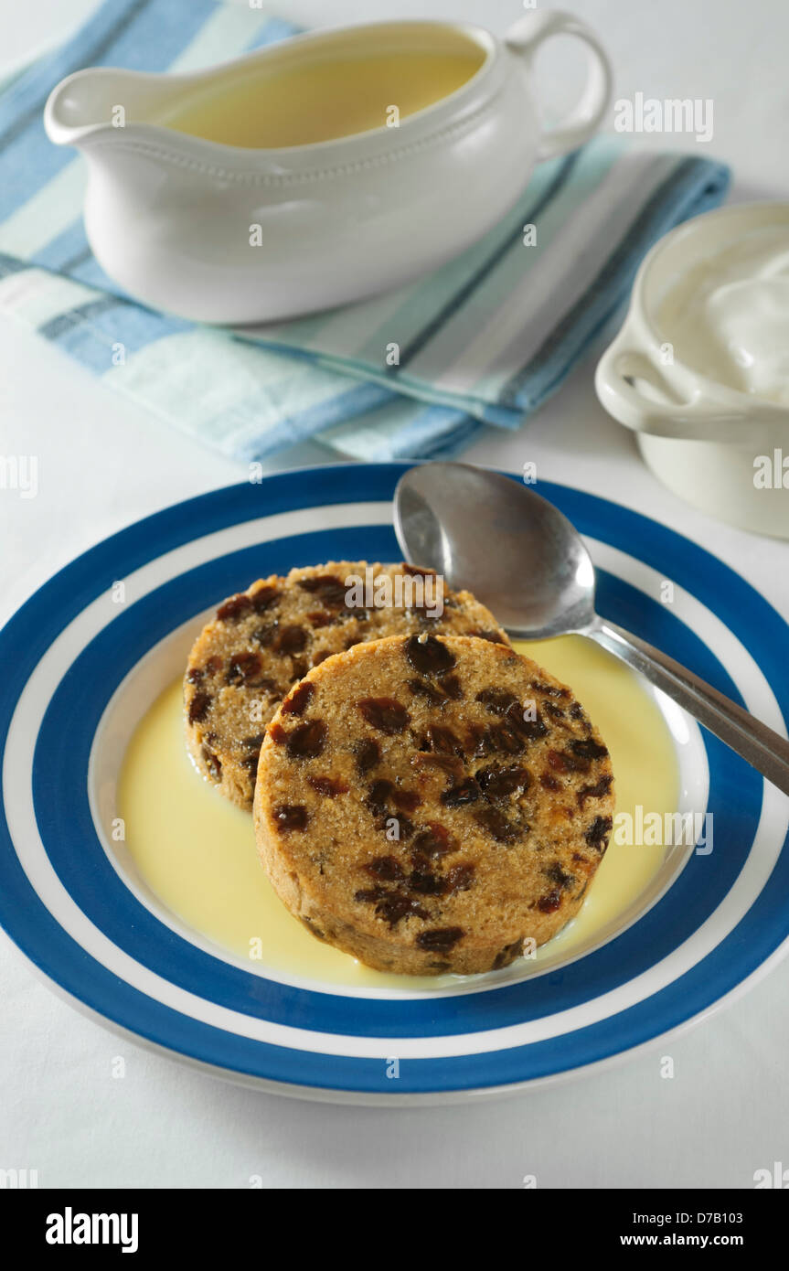 Spotted Dick Steamed fruit pudding Traditional dessert UK Stock Photo ...