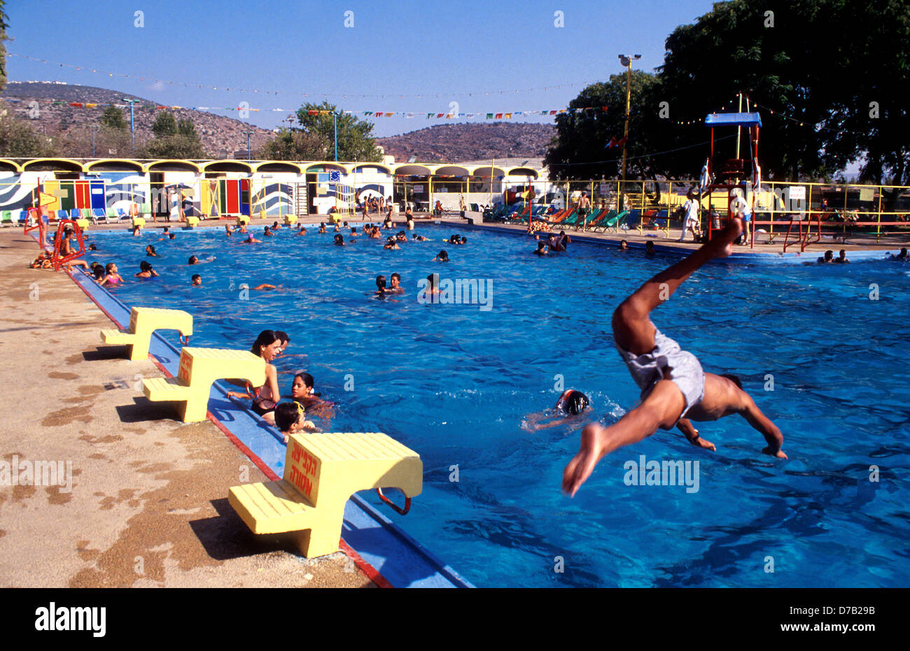 Jumping into swimming Pool Stock Photo - Alamy