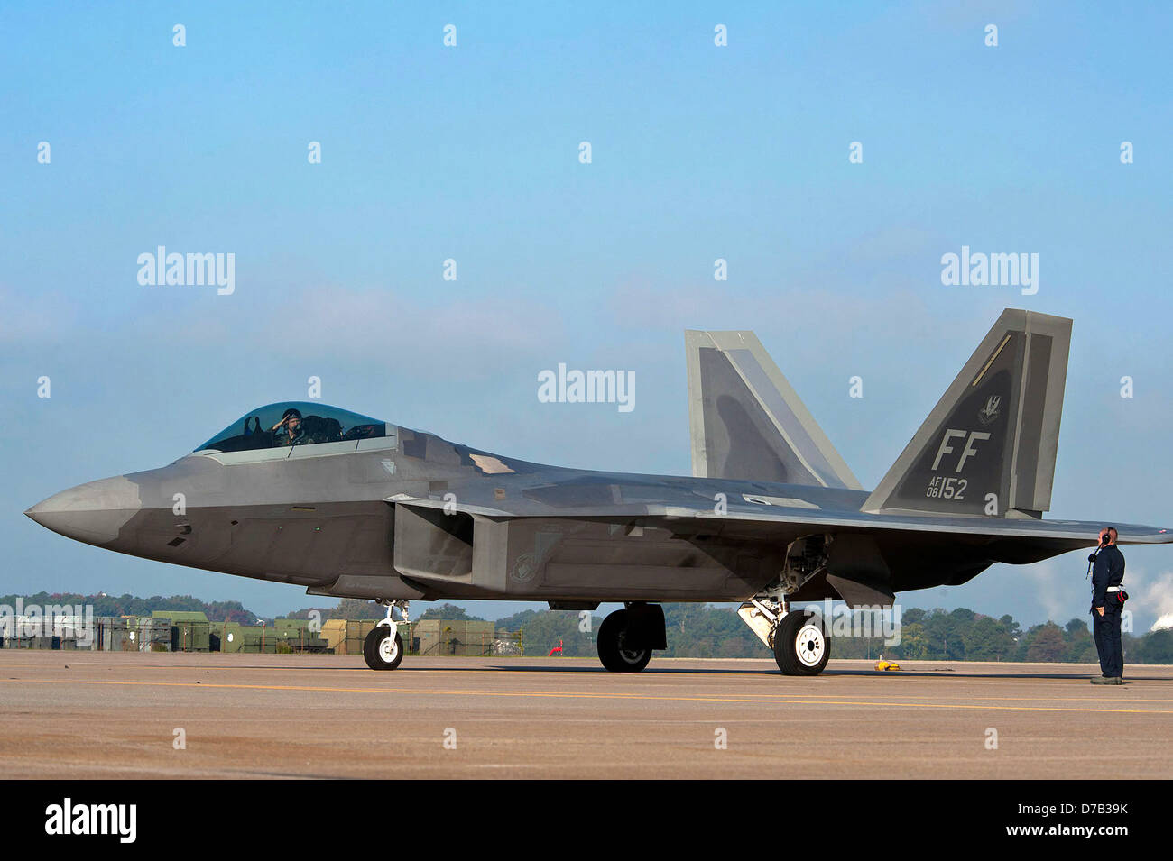 A US Air Force F-22 Raptor stealth fighter aircraft taxi to take off ...