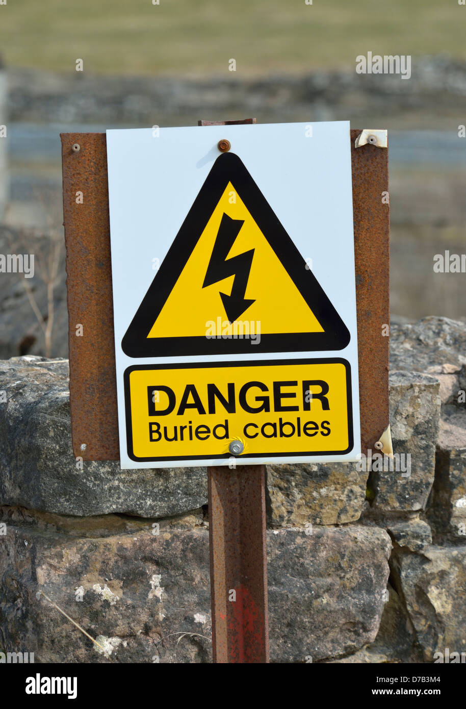 'DANGER Buried cables' sign. Shap Beck Quarry, Shap, Cumbria, England ...