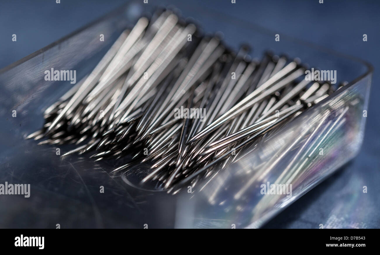 Steel pins in a box Stock Photo - Alamy