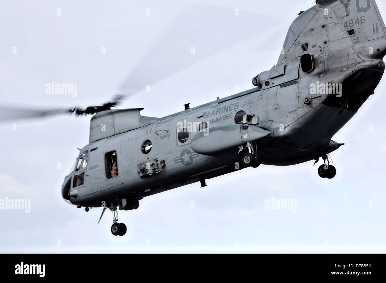 A US Marine Corps CH-46E Sea Knights helicopter conducts flight operations aboard San Antonio ...
