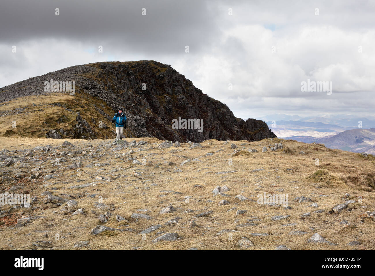A walker ascending on the Pony Path on the welsh mountain Cadair Idris ...