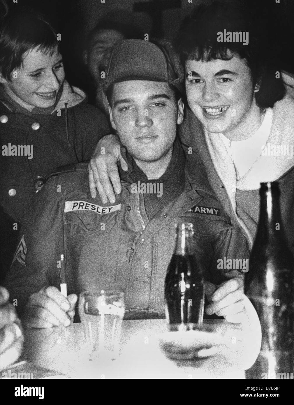 US rock star Elvis Presley is surrounded by fans on the 6th of February ...