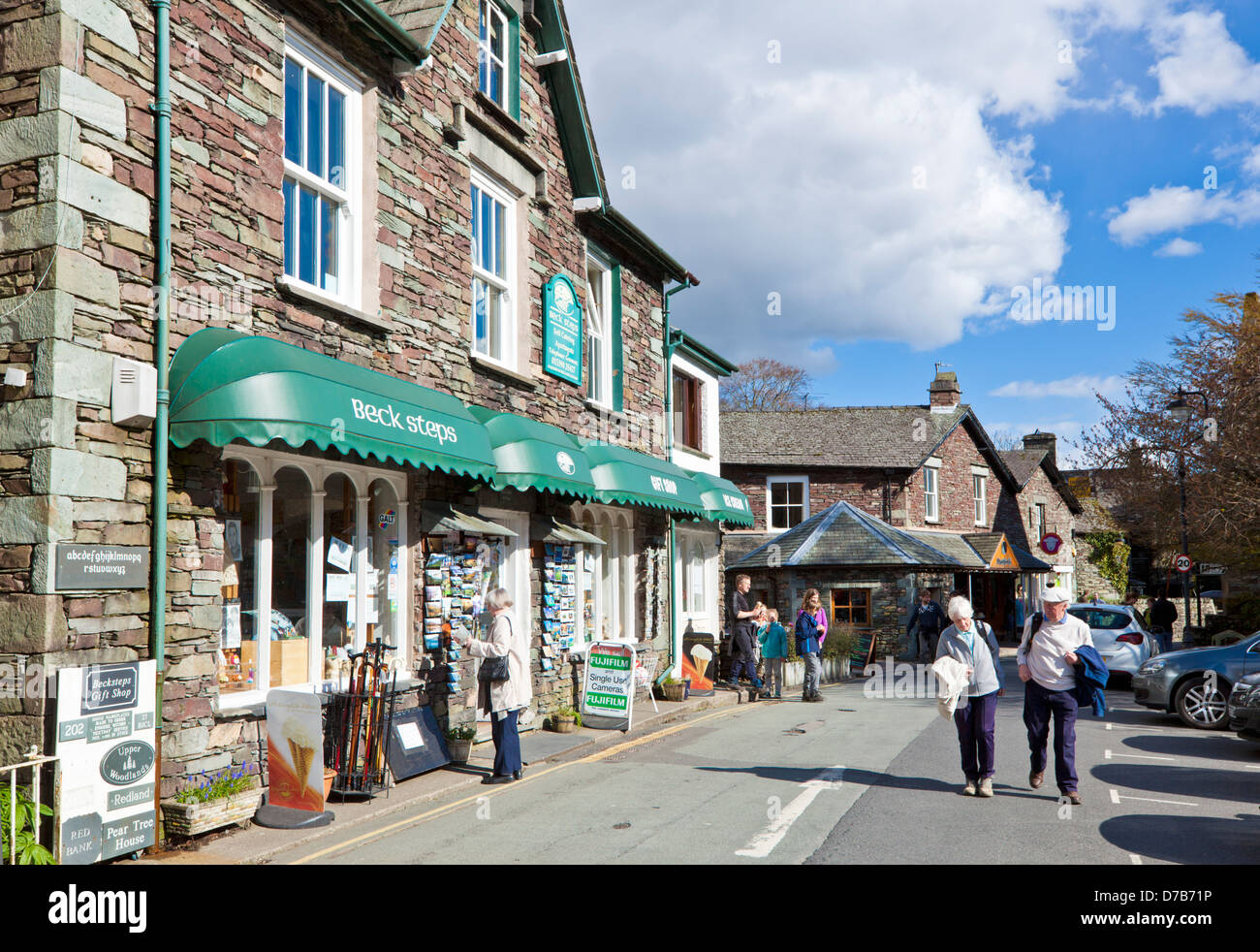 Grasmere Cumbria Tourists wandering around Grasmere Village with shops ...
