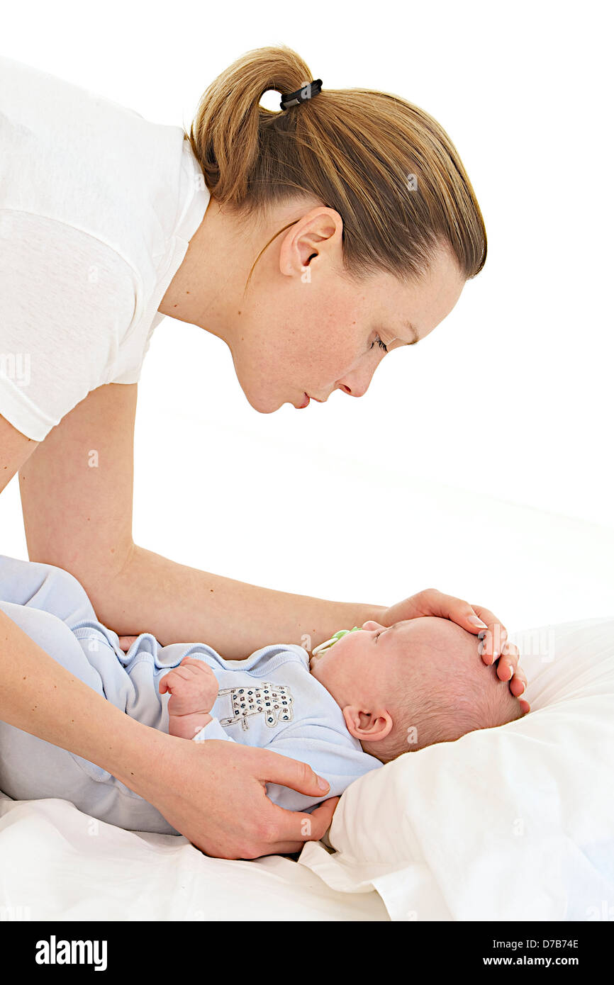 Mother comforting child in bed hi-res stock photography and images - Alamy