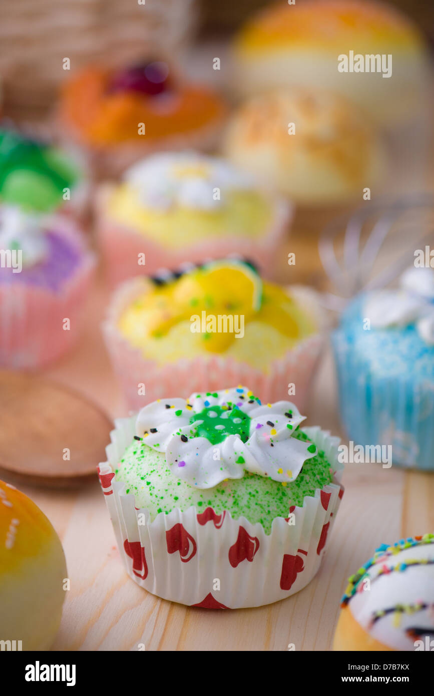 cup cakes with a lot of bread pastry background Stock Photo - Alamy