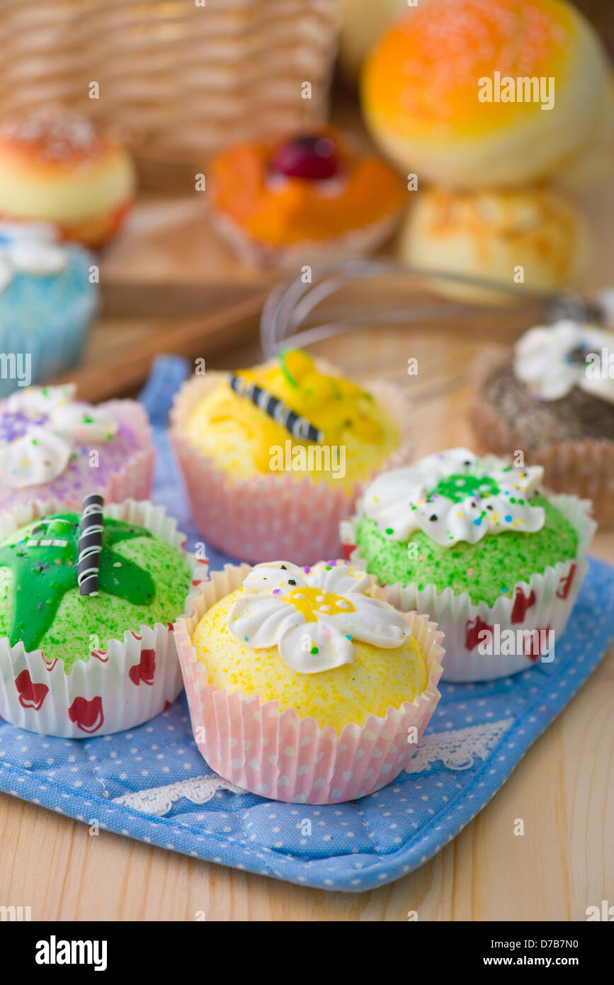 cup cakes with a lot of bread pastry background Stock Photo - Alamy