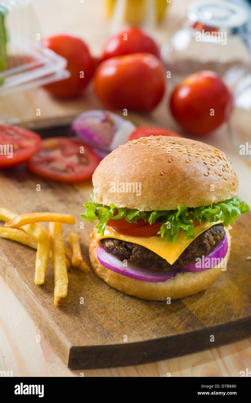 hamburger fast food with plenty of raw materials on the background ...