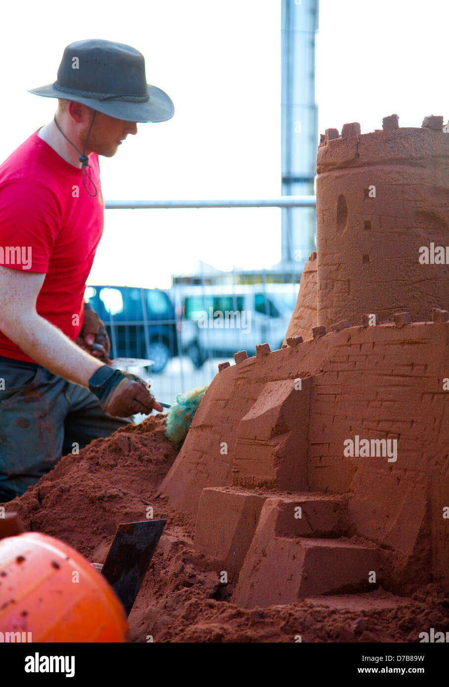 Sand artists Sand In Your Eye creating a sculpture of a castle on Rhyl ...