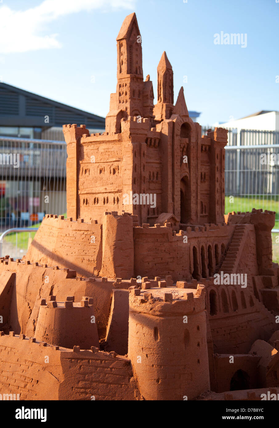 Sand artists Sand In Your Eye creating a sculpture of a castle on Rhyl ...