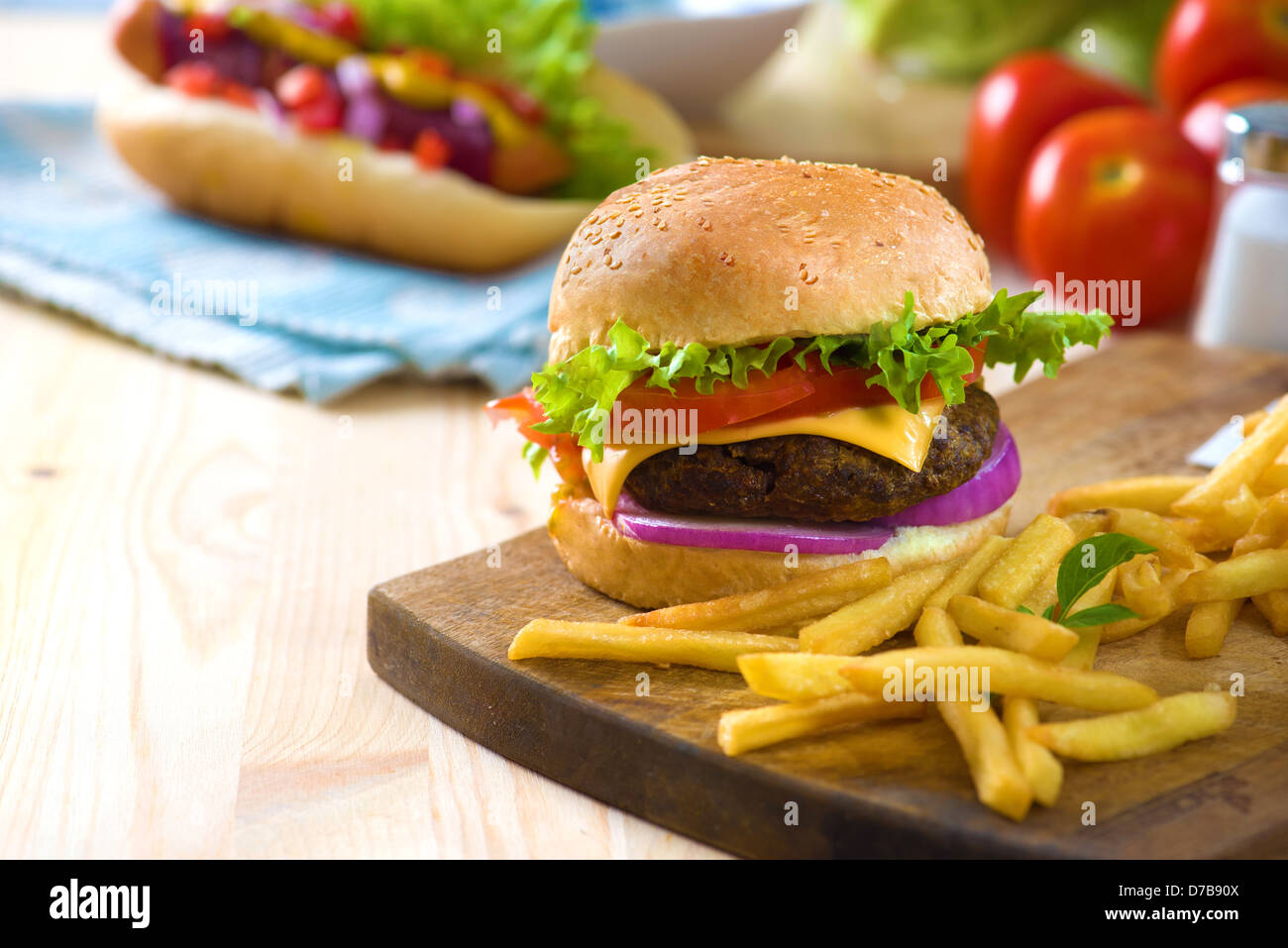 hamburger fast food with plenty of raw materials on the background ...