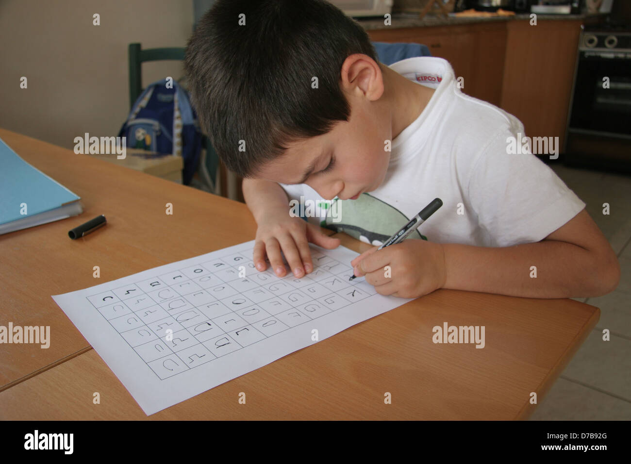 young boy learning to write Stock Photo - Alamy
