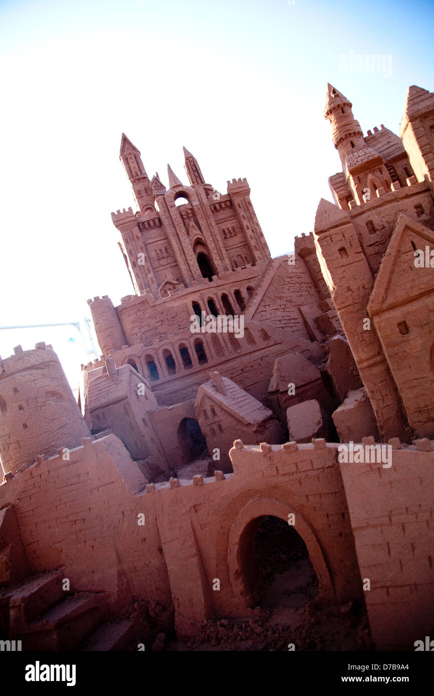 Sand artists Sand In Your Eye creating a sculpture of a castle on Rhyl ...