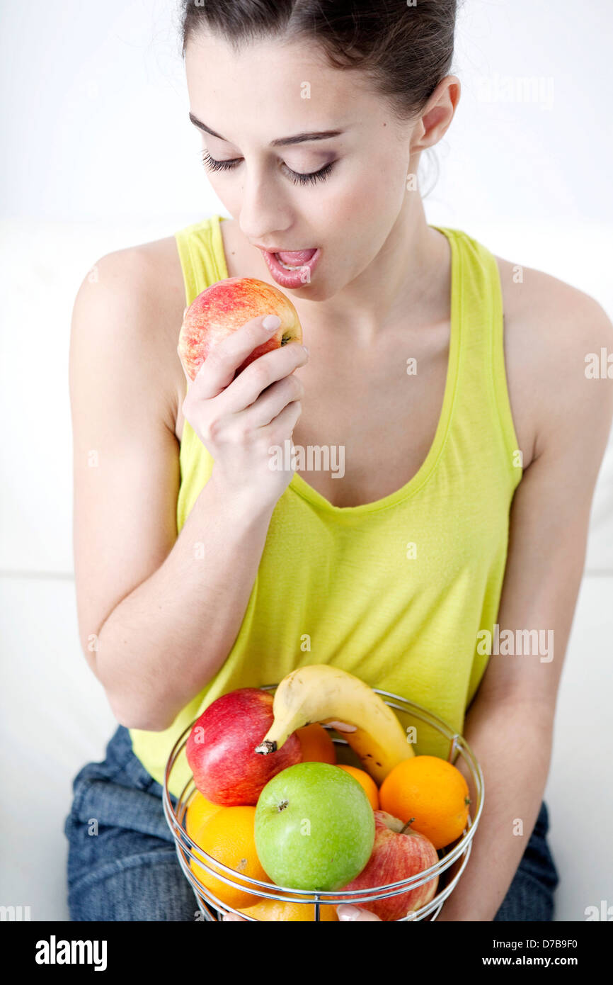 WOMAN EATING FRUIT Stock Photo - Alamy