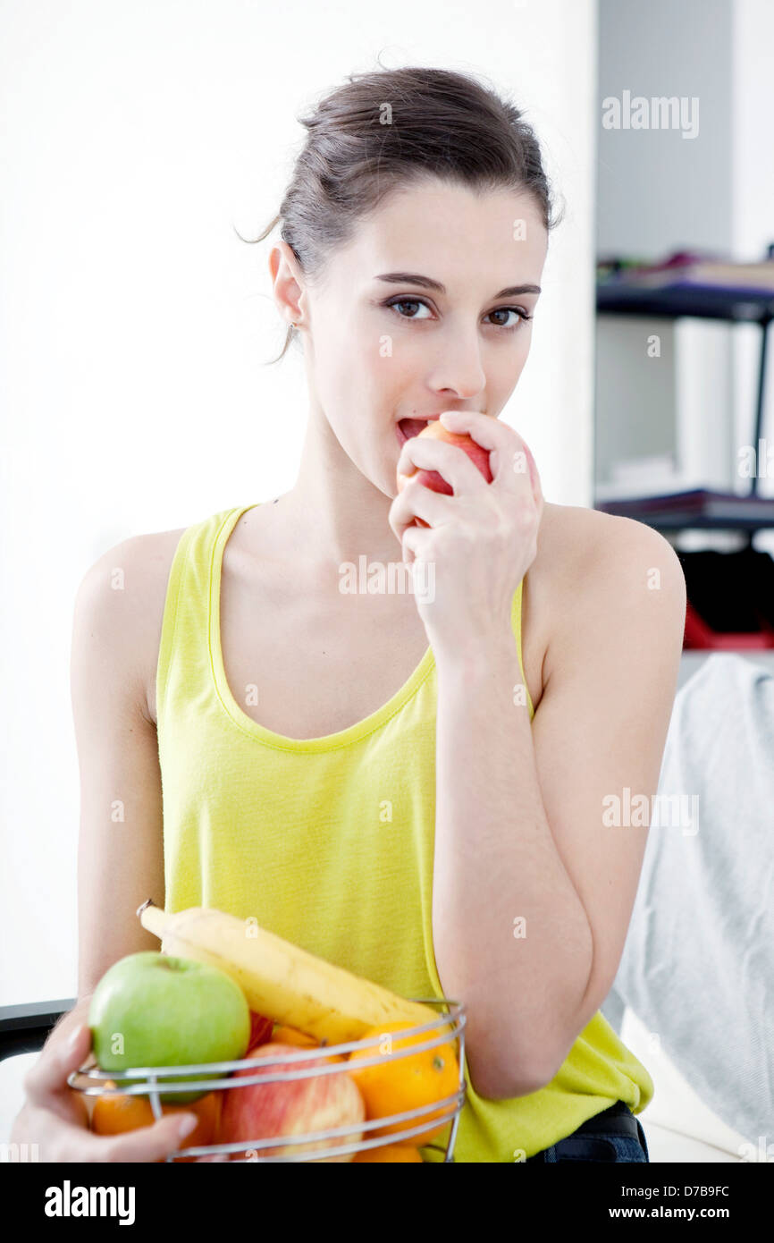 WOMAN EATING FRUIT Stock Photo - Alamy